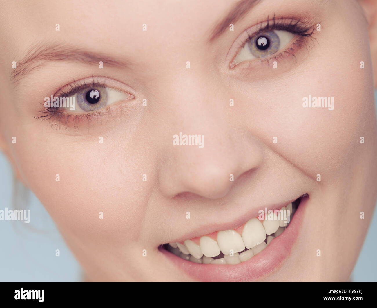 Focus attention on eyes closeup woman face. Smiling young girl with ...