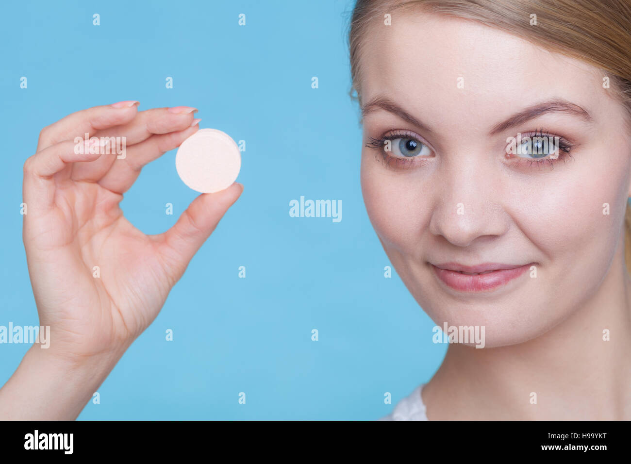 Vitamins, health, medicines. Woman holding behing her face big ...