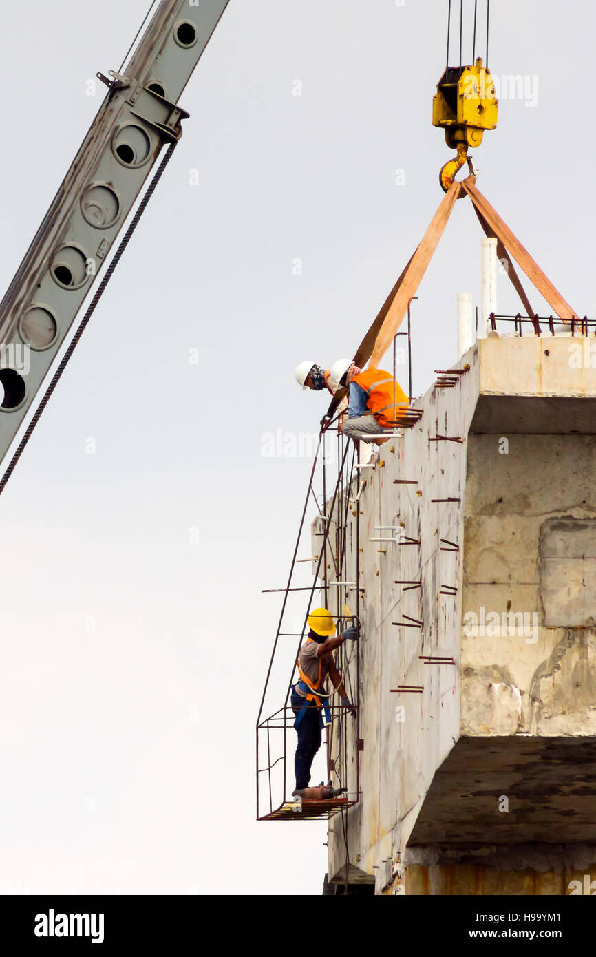 People working at a bridge column construction which is build for the ...