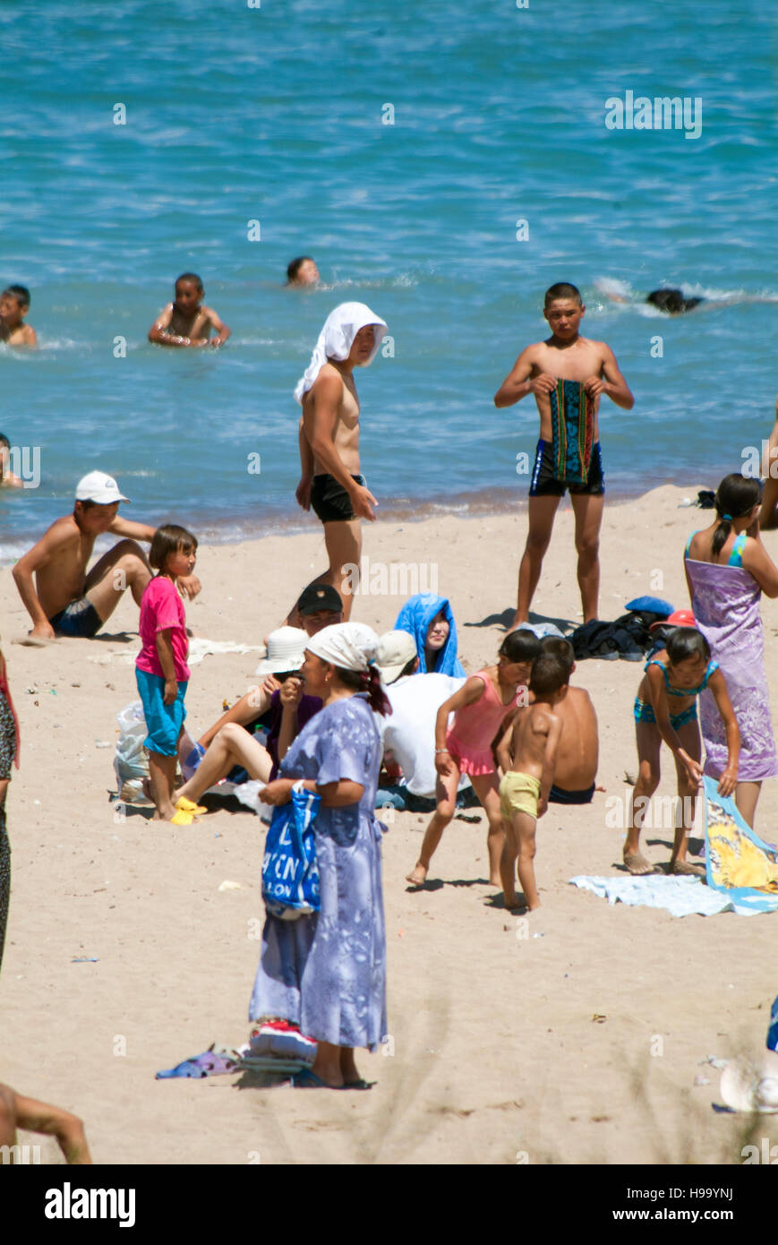 People bathing on the shore of Lake Issyk Kul Stock Photo - Alamy