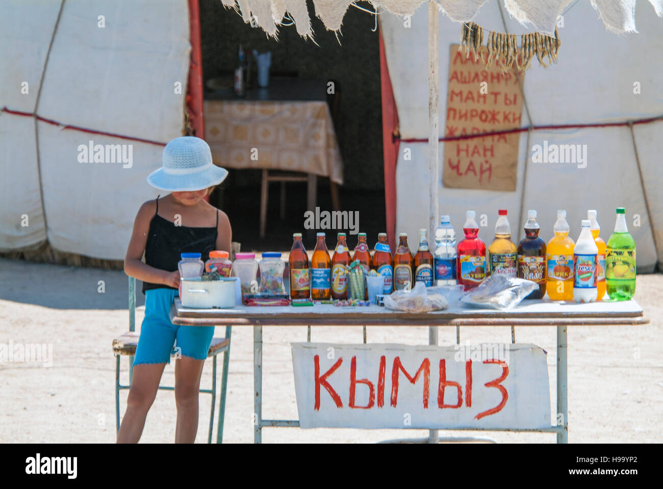 A girl selling kumis, fermented mare's milk and a popular summer drink ...