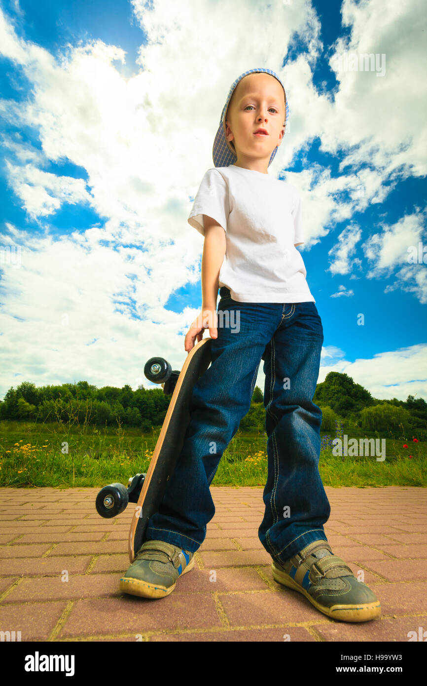 Active childhood. Little man skateboarding. Skater boy child kid with ...