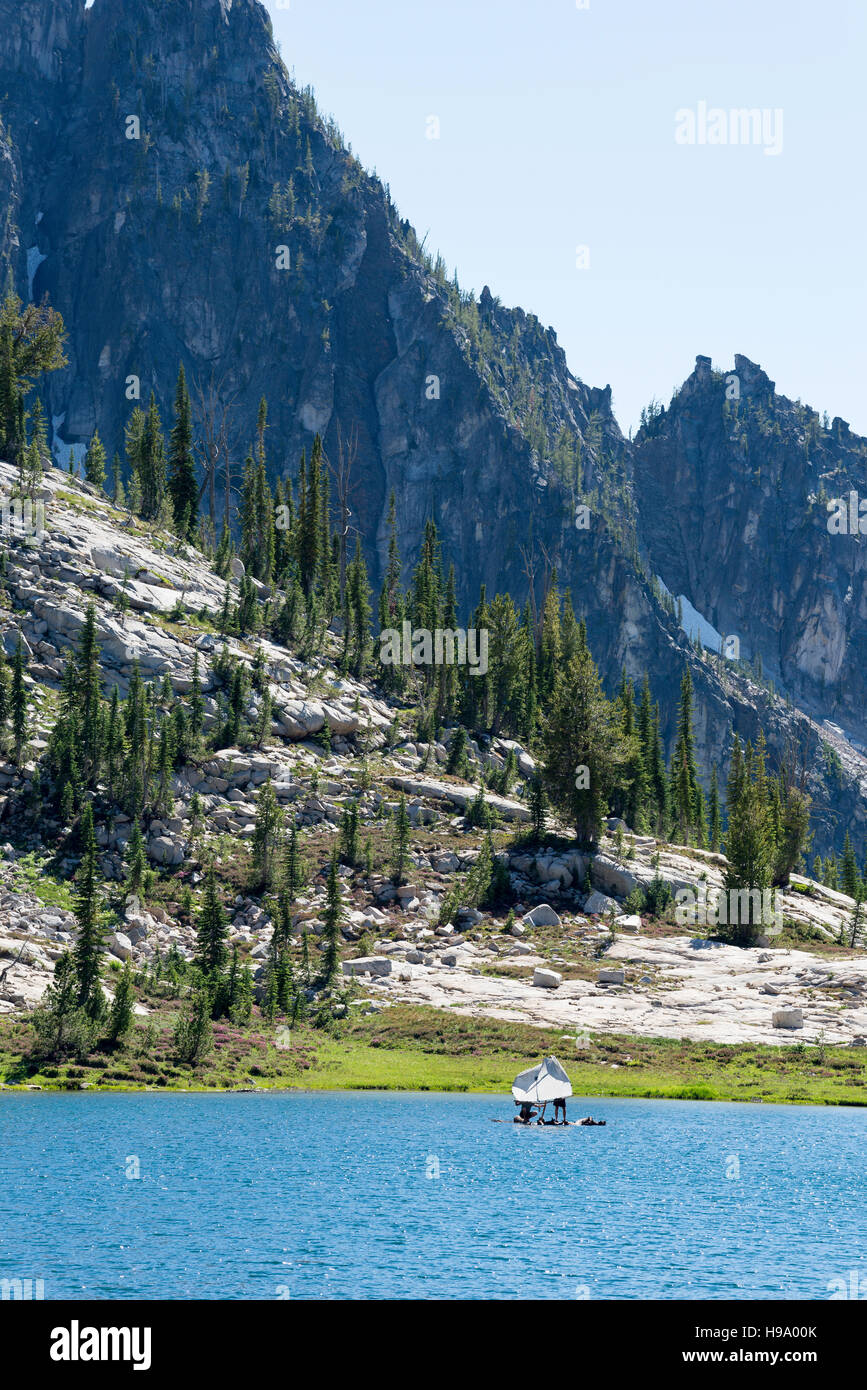 Sailing a jerry-rigged log raft across a lake in Oregon's Wallowa ...