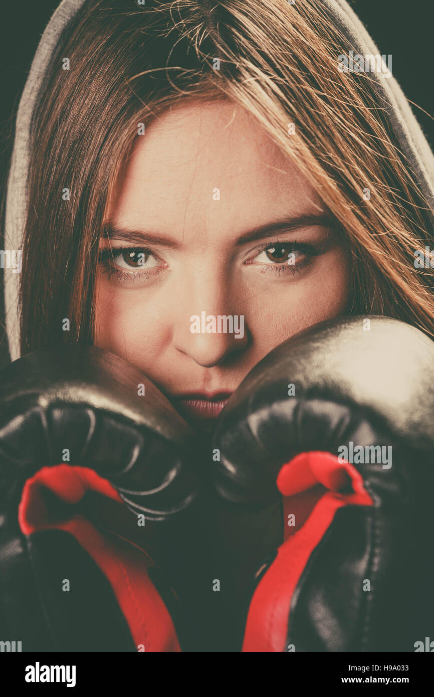 Fighting boxing and defense. Sportsmanship and strong body. Young woman ...