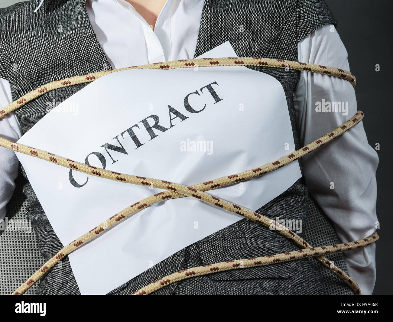 Closeup of businesswoman bound by contract terms and conditions. Woman ...