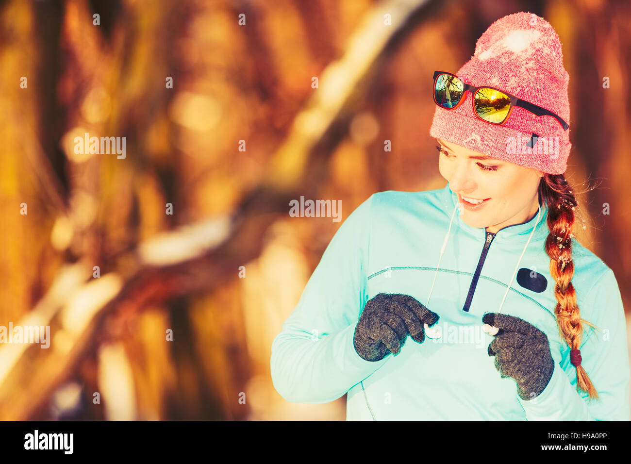 Fit girl in winter park. Exercising among snow and nature. Health ...