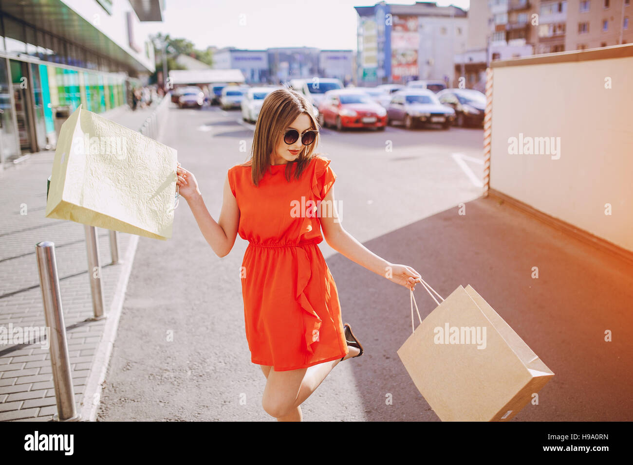 two beautiful young women walk to the shops and make purchases Stock ...