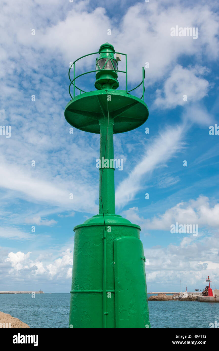 Little Green Metallic Lighthouse, Blue Sky and Clouds in Background ...