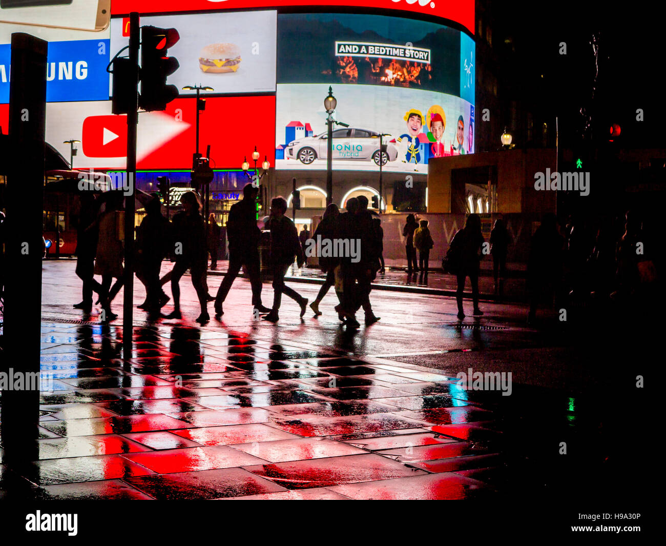 Rain reflects Piccadilly Circus lights in Central London Stock Photo ...