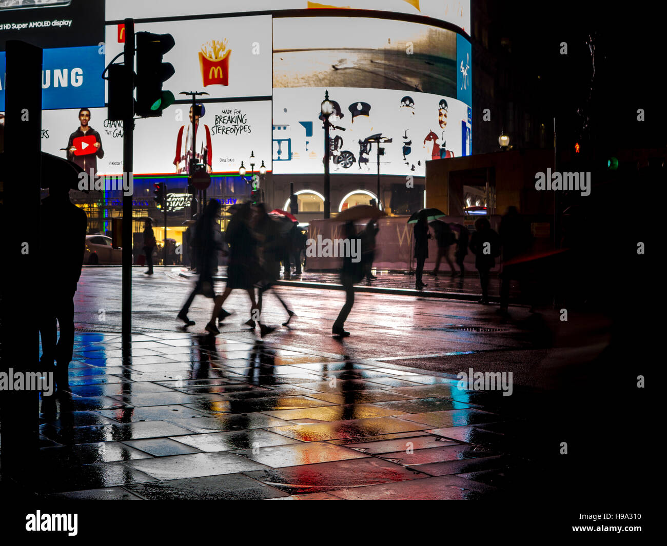 Rain reflects Piccadilly Circus lights in Central London Stock Photo ...