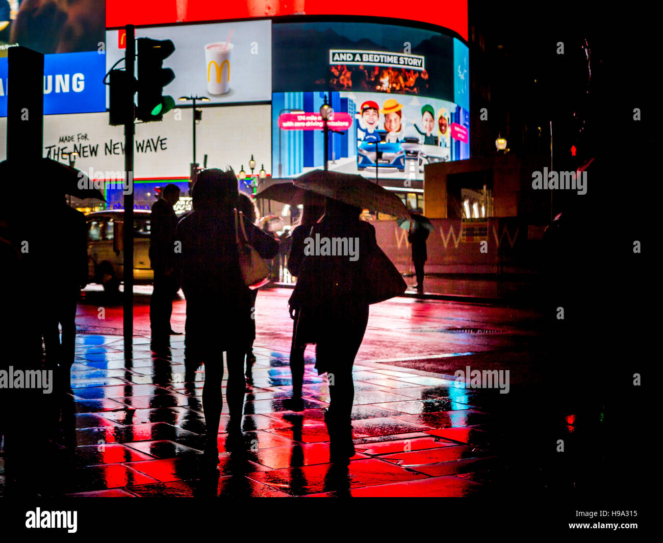 Rain reflects Piccadilly Circus lights in Central London Stock Photo ...
