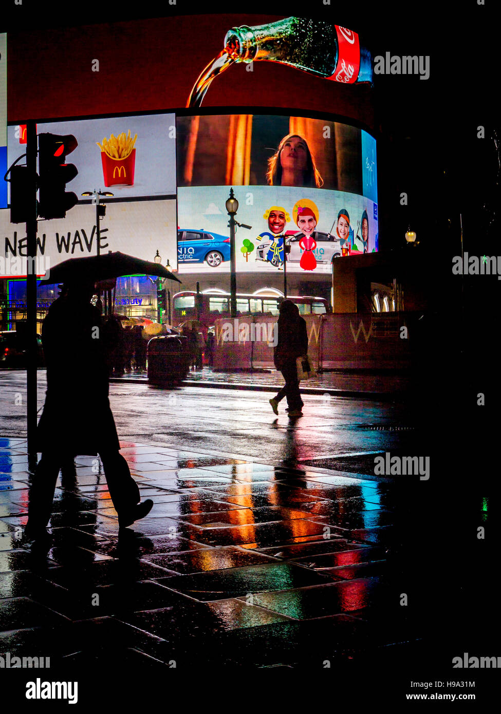 Rain reflects Piccadilly Circus lights in Central London Stock Photo ...