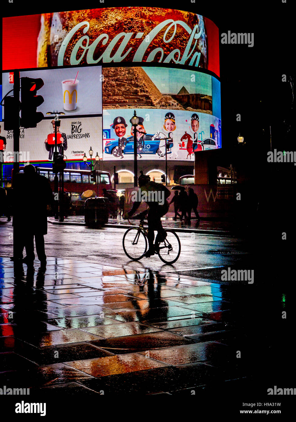 Rain reflects Piccadilly Circus lights in Central London Stock Photo ...