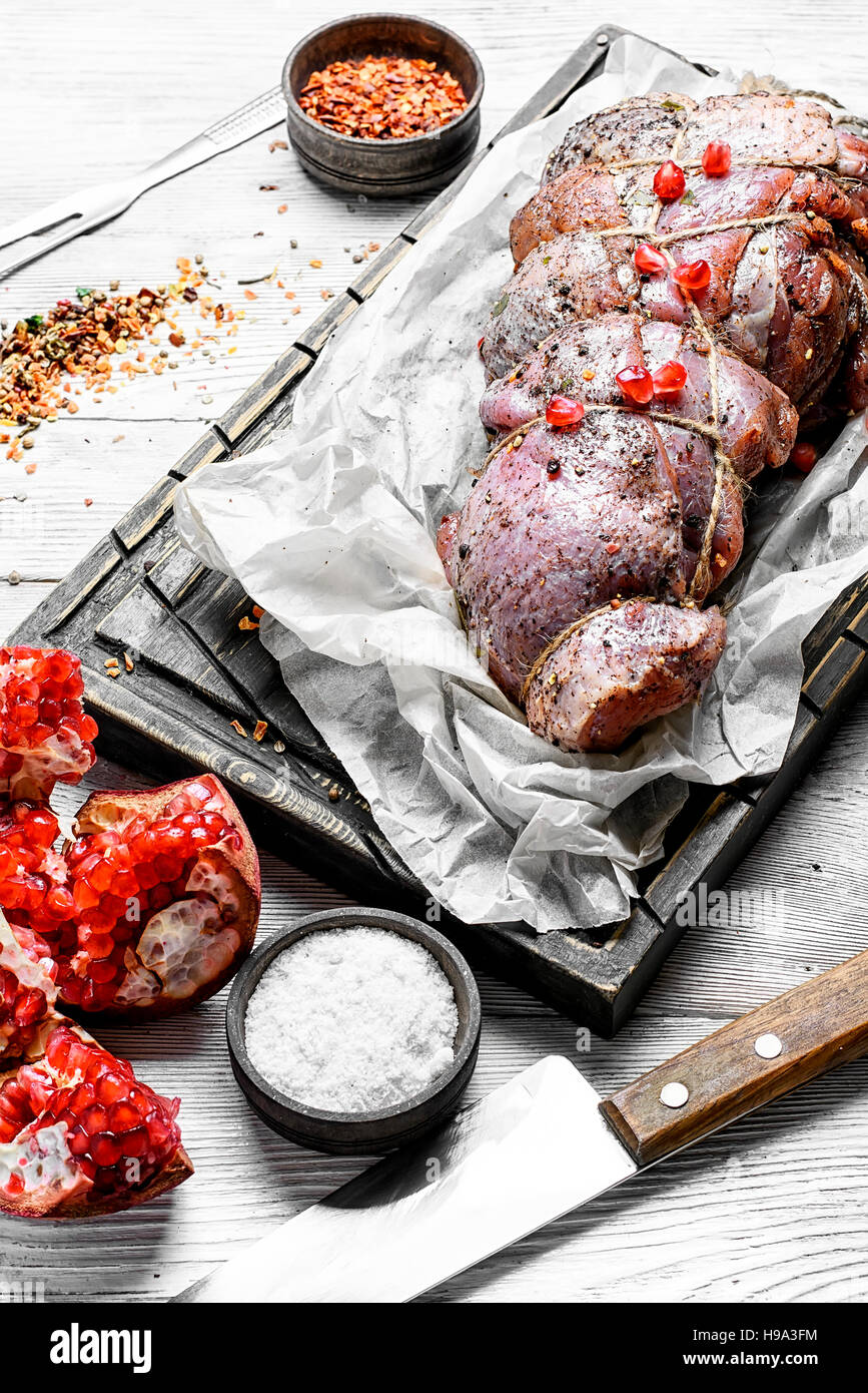 Meat knuckle ,soaked in pomegranate sauce and spices Stock Photo - Alamy