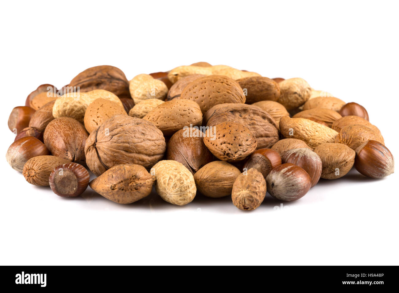 Mixed nuts in shells on a white background Stock Photo - Alamy