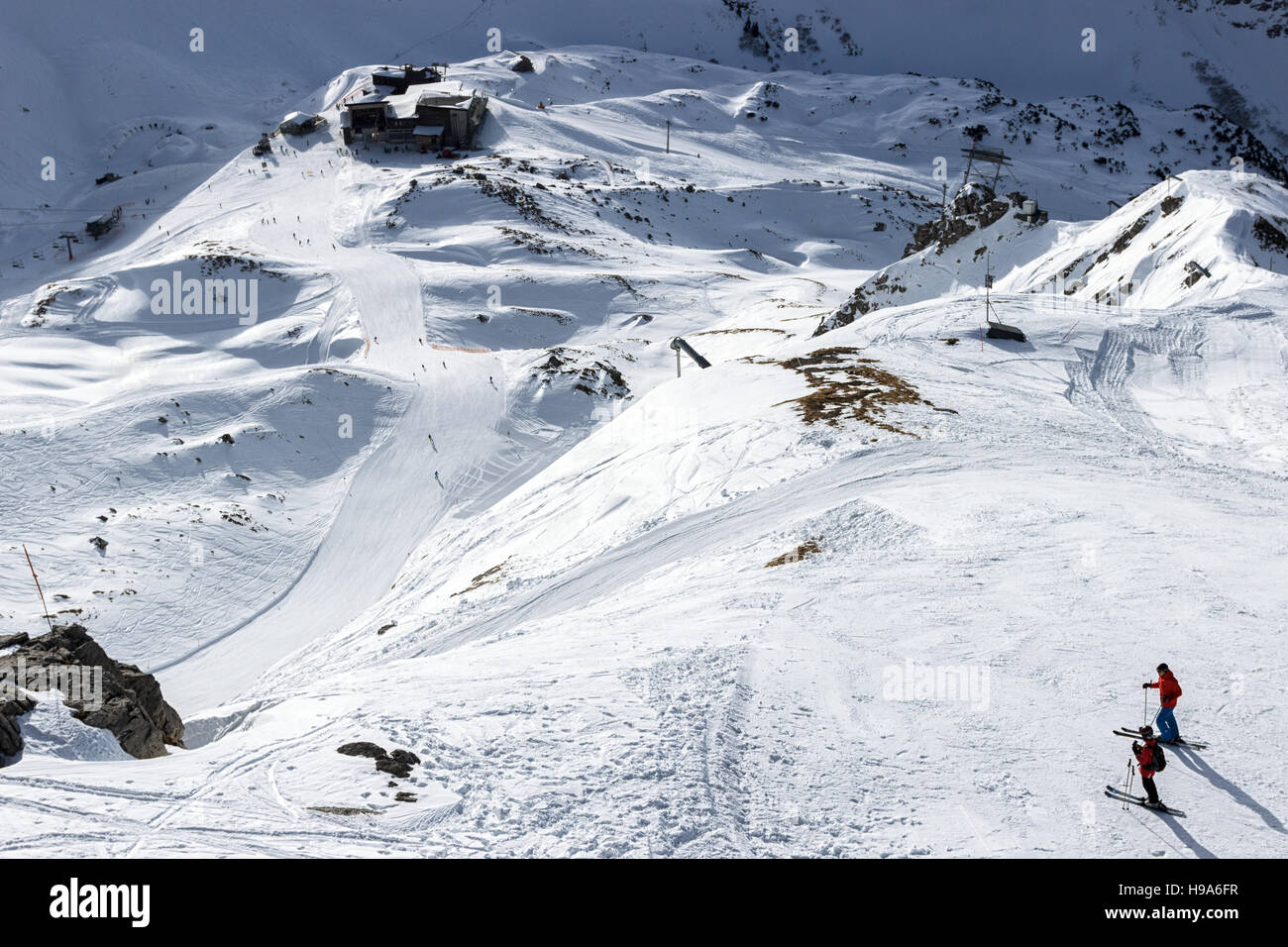 Hilly mountain ski run with skier Stock Photo - Alamy