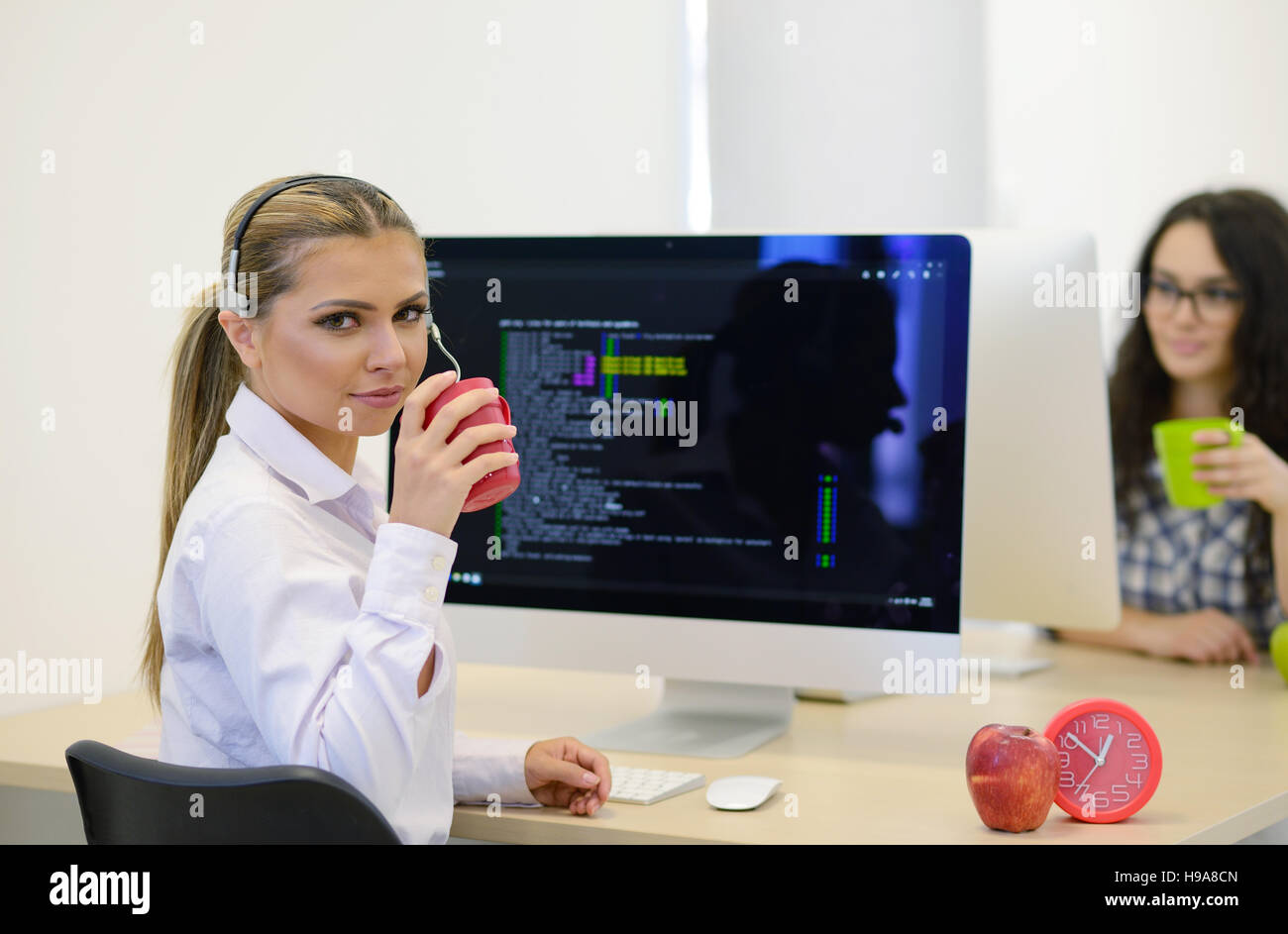 Beautiful businesswoman holding apple hi-res stock photography and ...