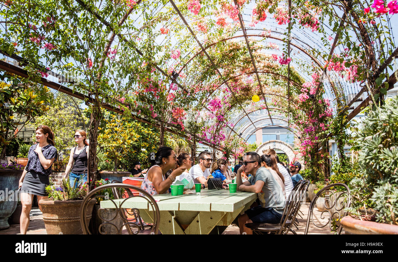 People dining under a canopy of leaves at The Grounds, Alexandria ...