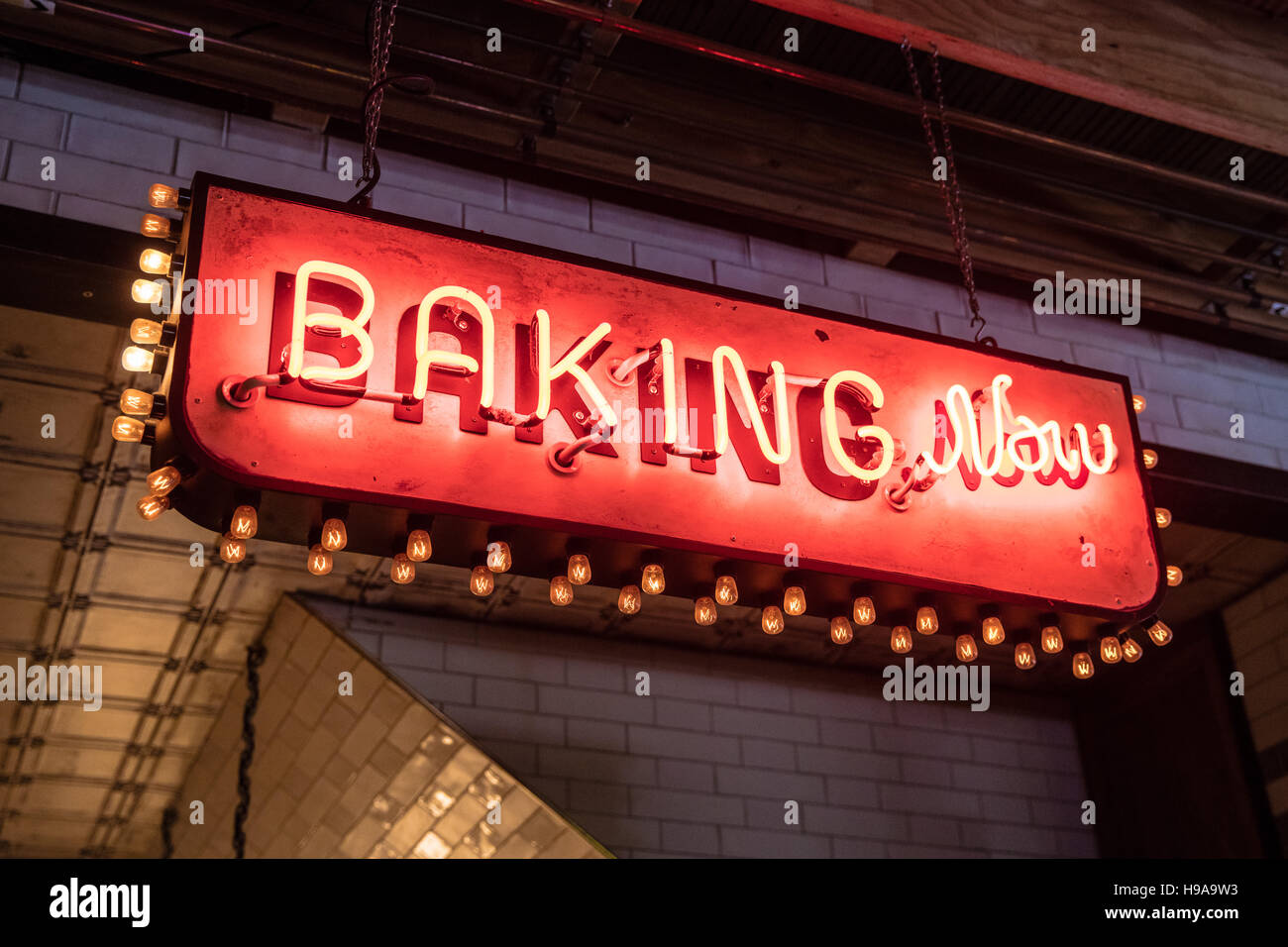 A retro sign saying "Baking Now Stock Photo - Alamy
