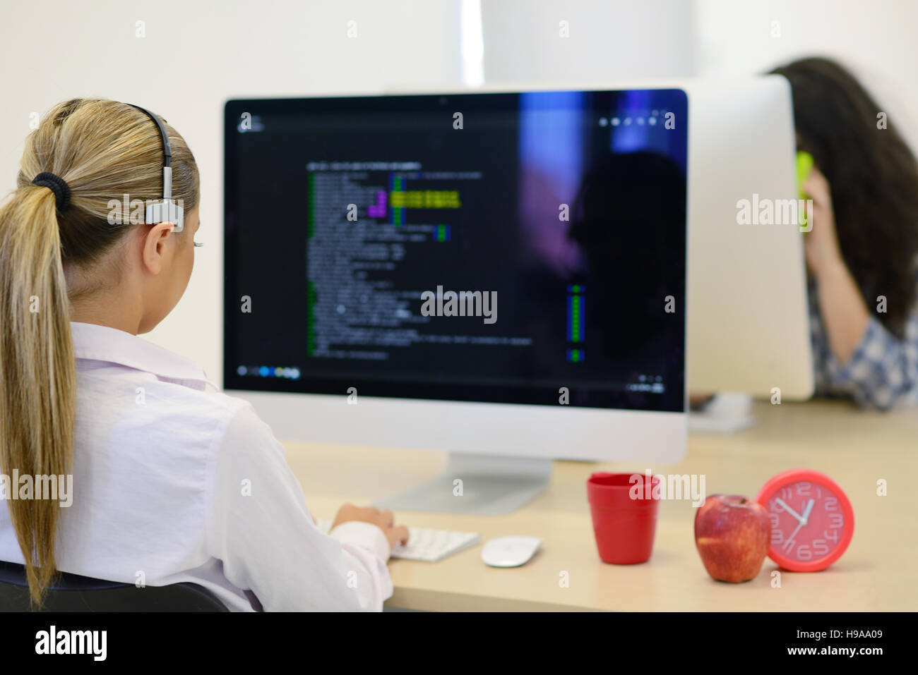 startup business, young woman as software developer working on computer ...