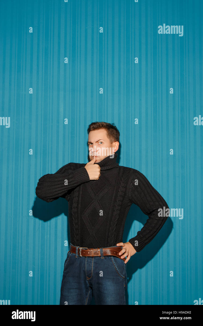 Portrait of young man with serious facial expression Stock Photo - Alamy