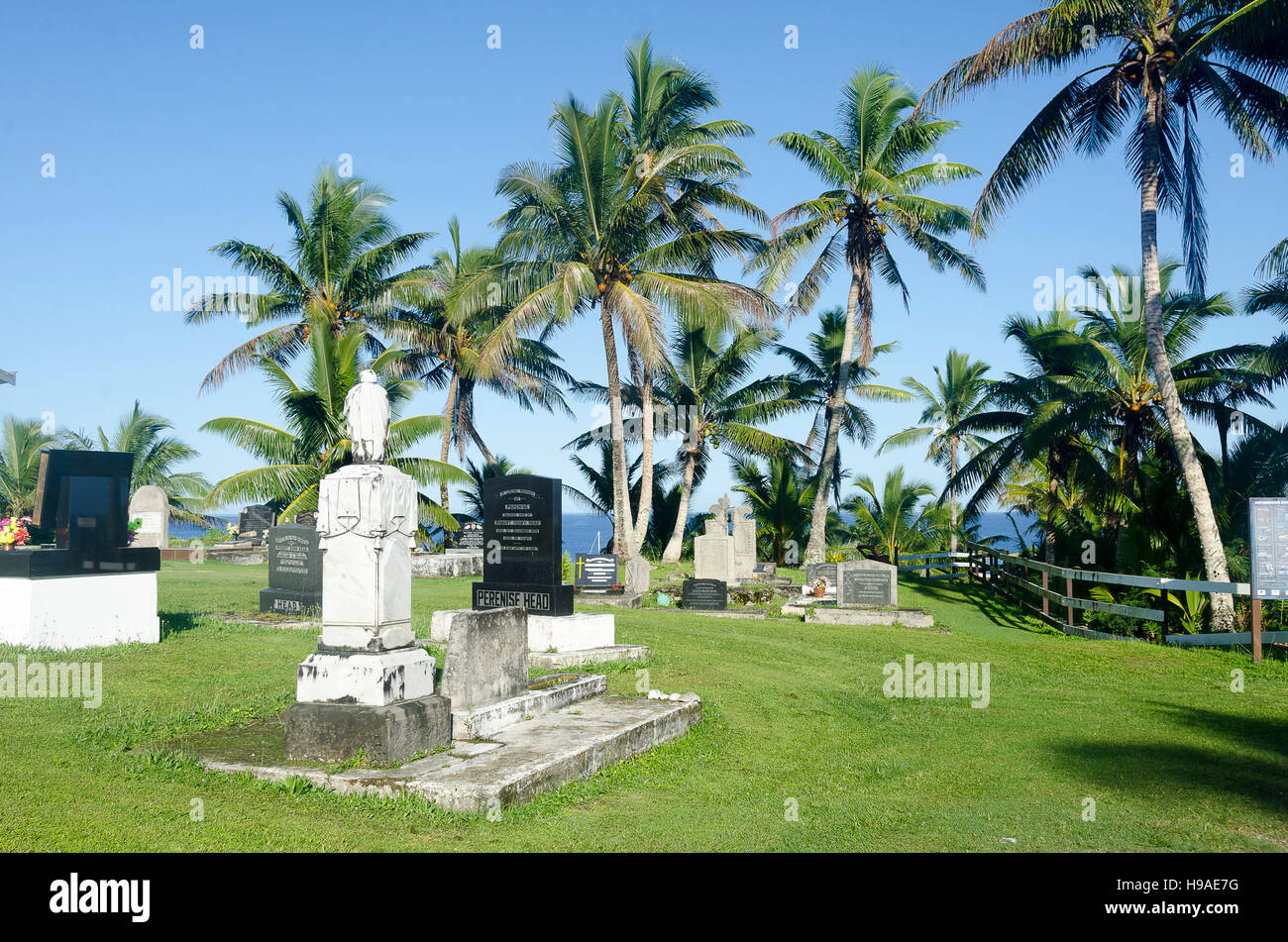 Graves and coconut trees at Tomb Point, Alofi, Niue, South Pacific ...