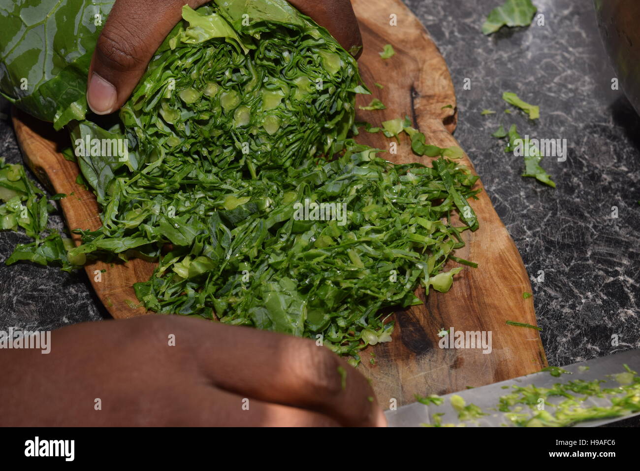 Gentle female hands chopping organic spinach Stock Photo - Alamy