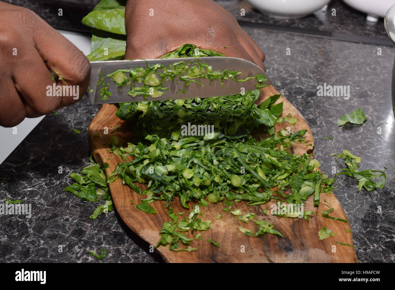 Gentle female hands chopping organic spinach Stock Photo - Alamy