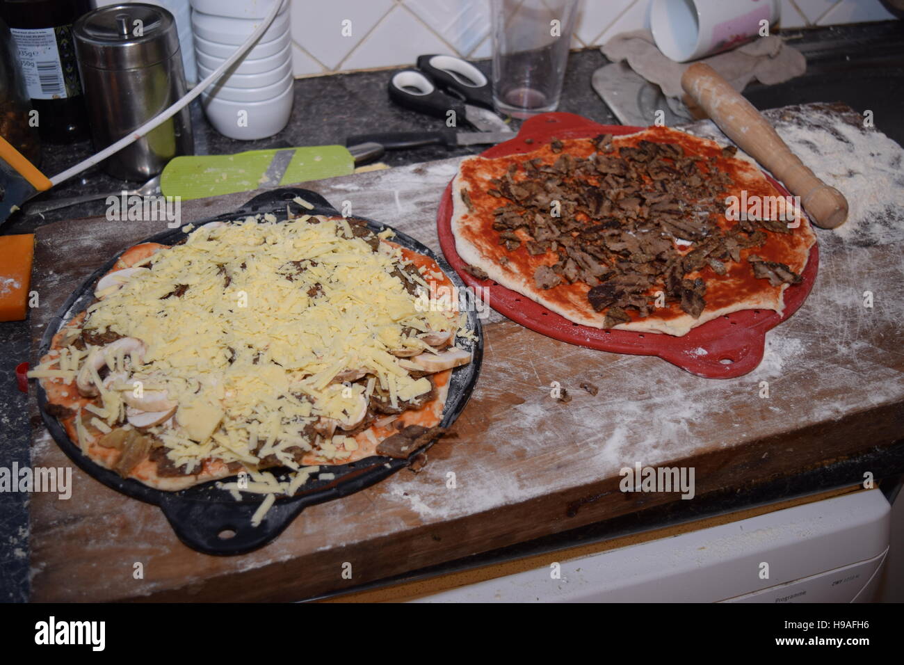 Two pepperoni pizzas with two different types cheese Stock Photo - Alamy