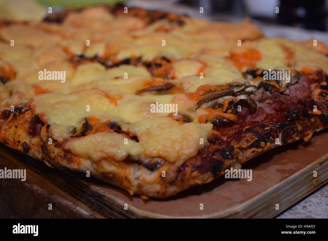 Rectangular pizza topped with blue cheese and tuna Stock Photo - Alamy