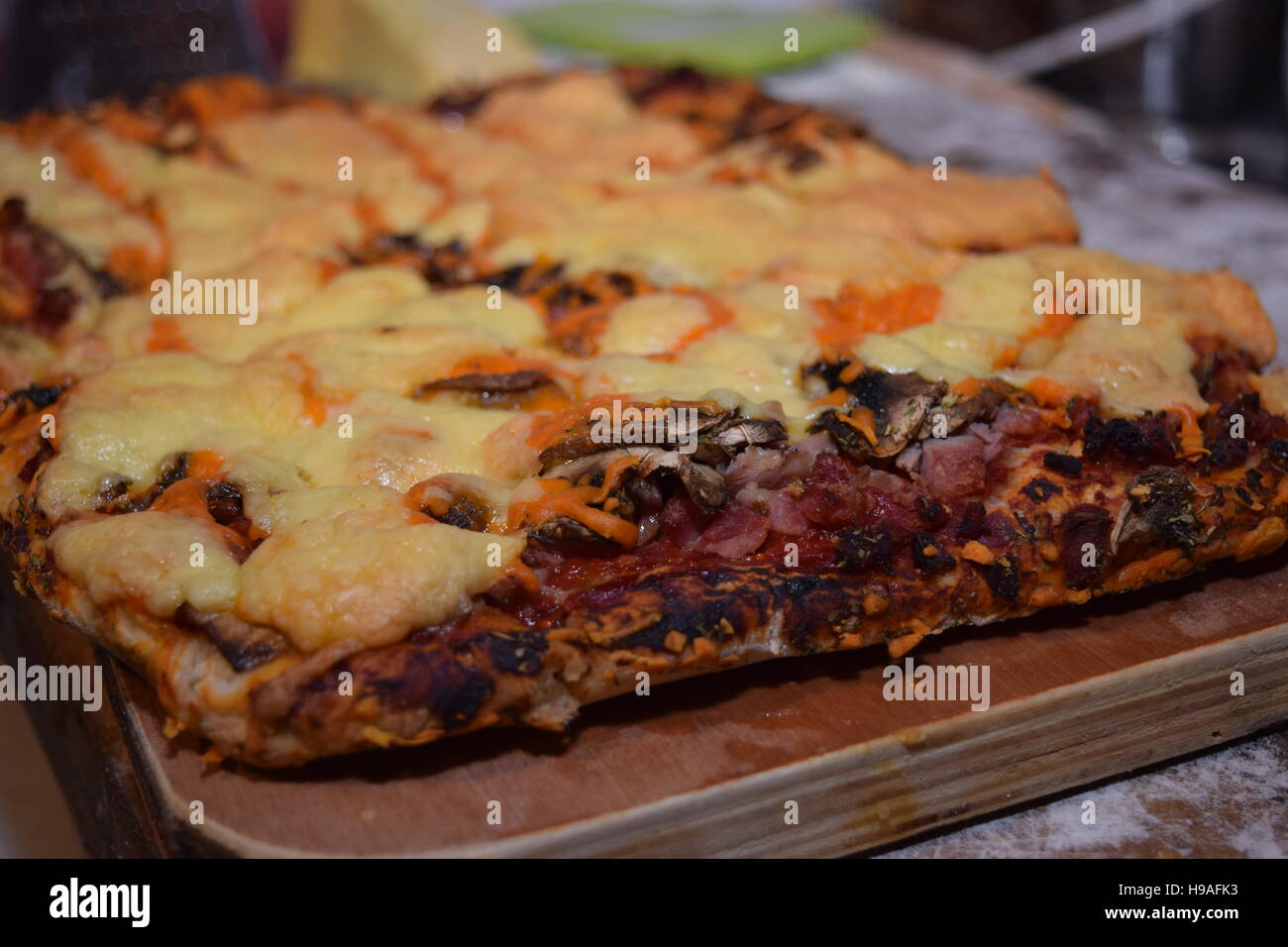 Homemade rectangular pizza with ingredients close up Stock Photo - Alamy