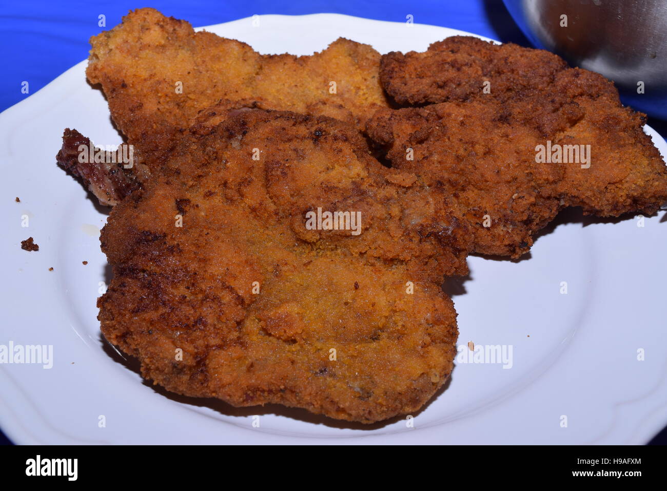 Freshly fried wiener schnitzel on a plate Stock Photo - Alamy