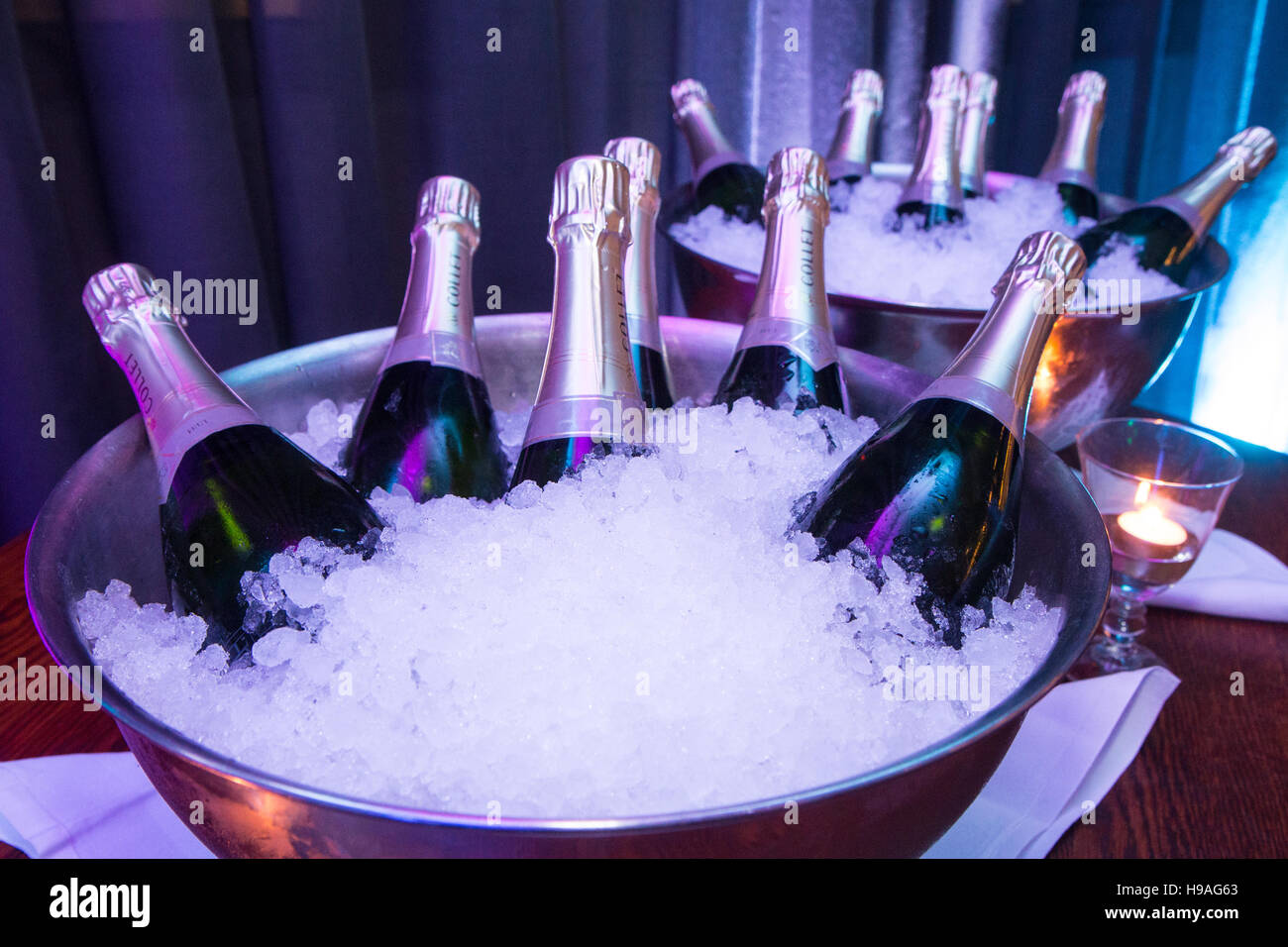 Bottles of Champagne on ice Stock Photo - Alamy