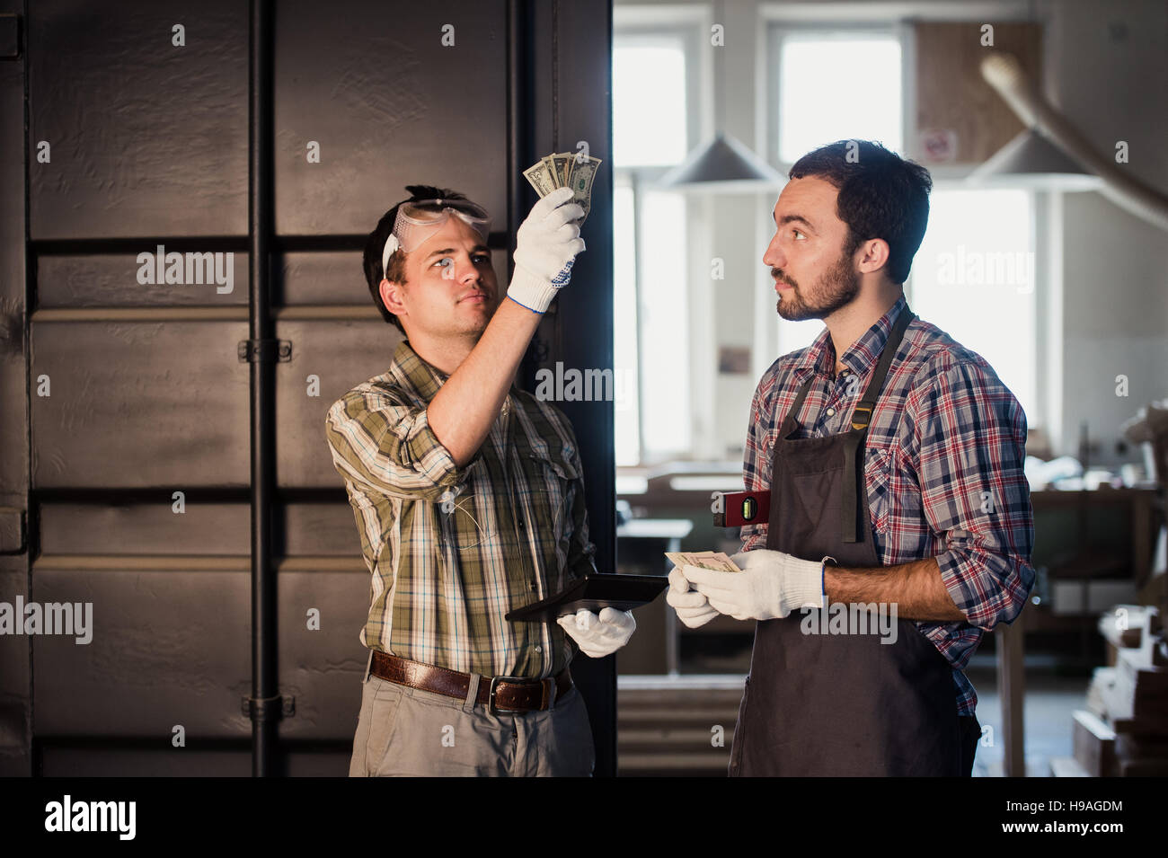 Happy construction worker money hi-res stock photography and images - Alamy