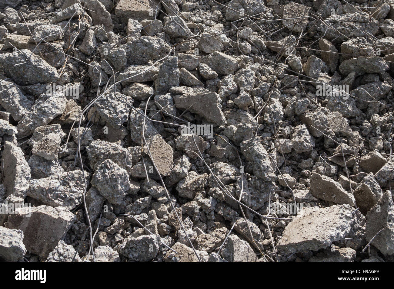 Broken shattered concrete with armature top view Stock Photo - Alamy