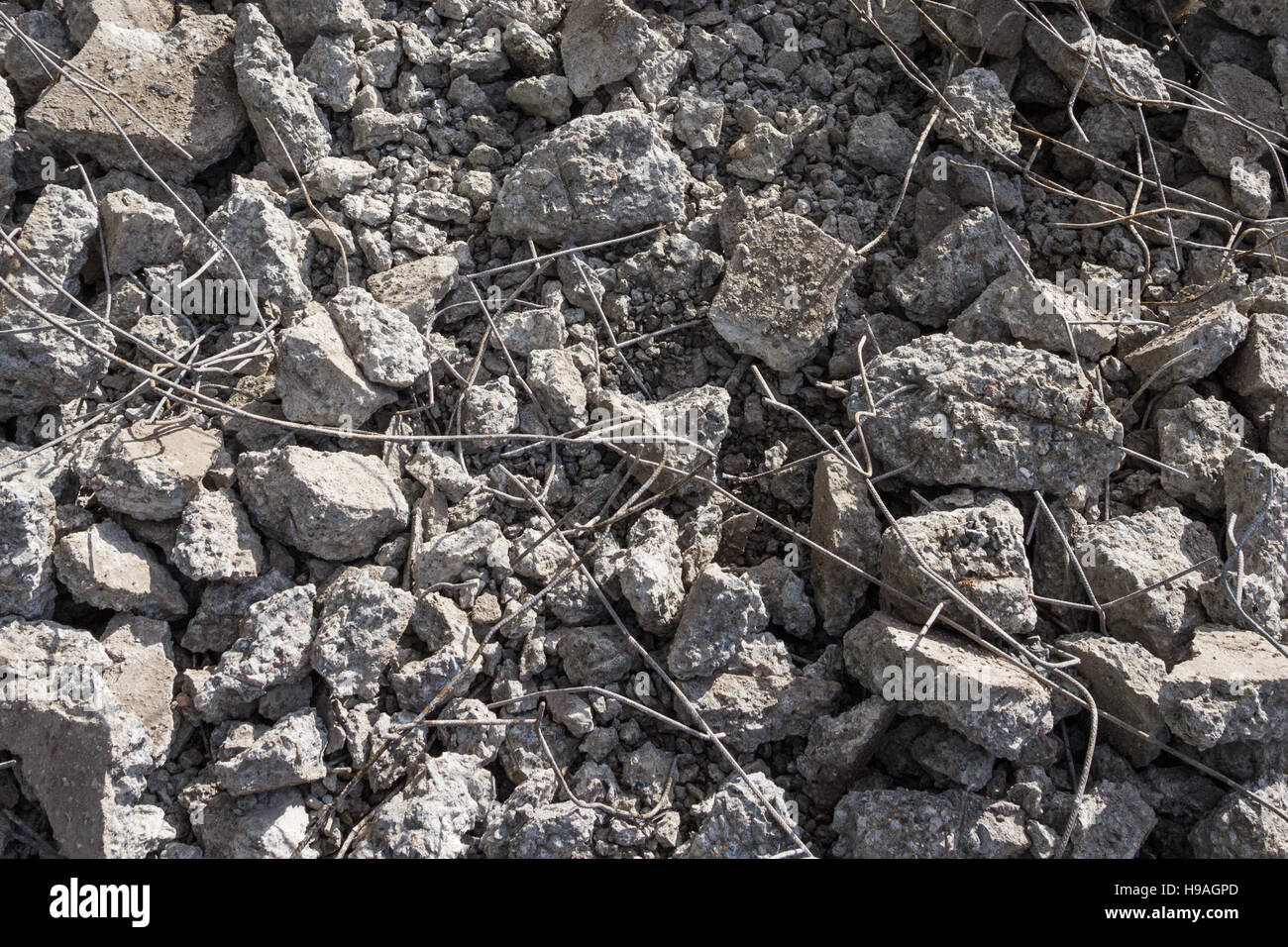 Broken shattered concrete with armature top view Stock Photo - Alamy