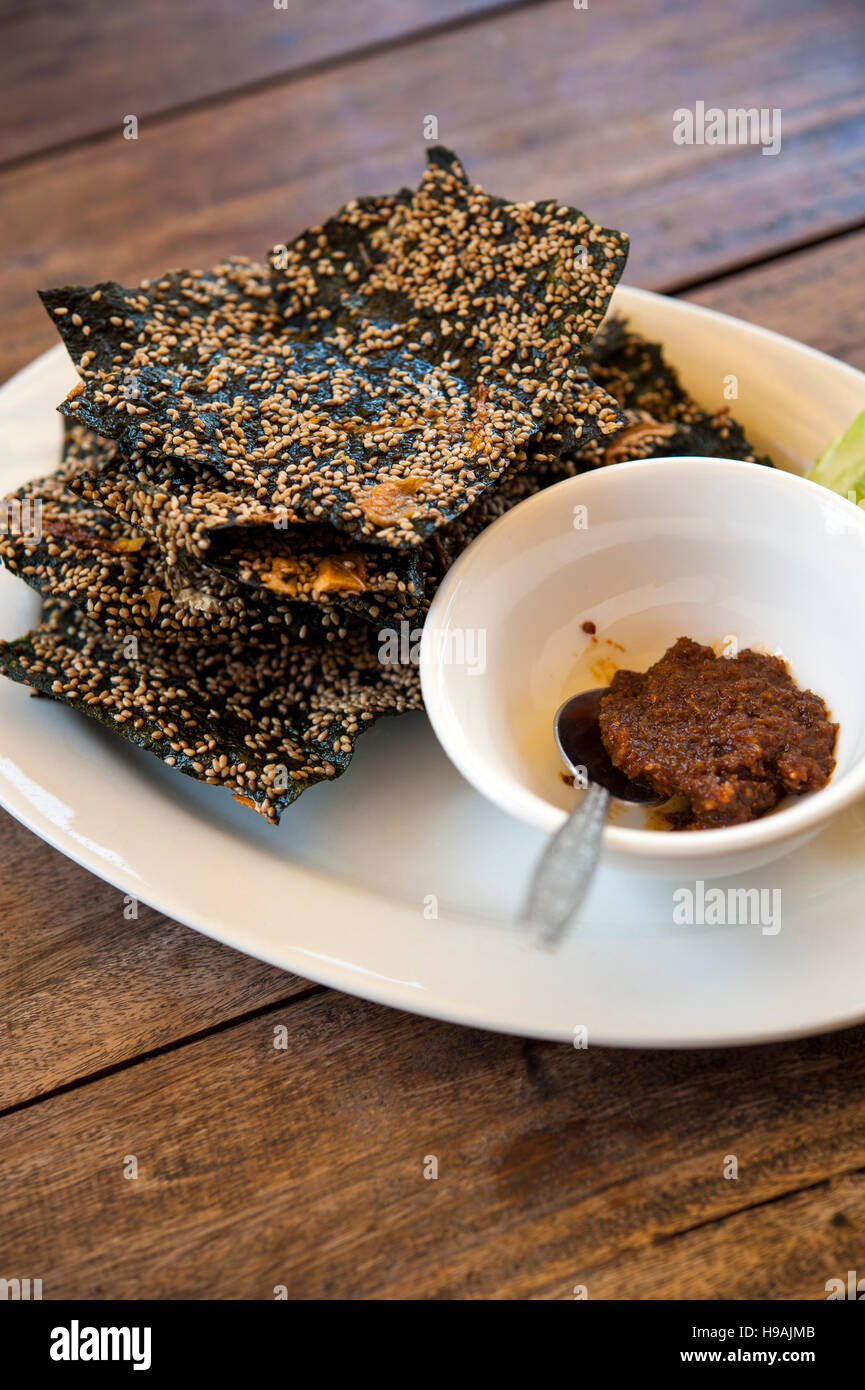 Fried river week with jeow bong, a sweet and spicy paste from Laos, at ...