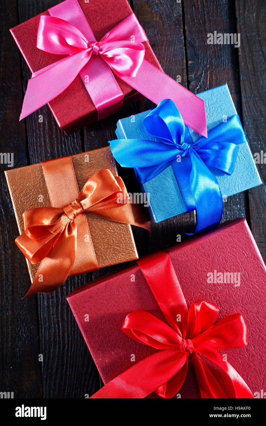 box for present with ribbons on a table Stock Photo - Alamy
