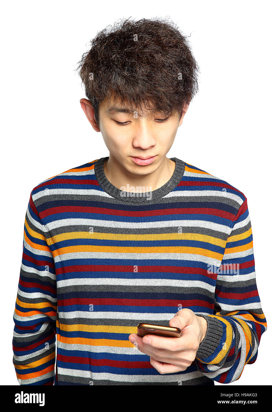 Young man using mobile phone texting on white background Stock Photo ...