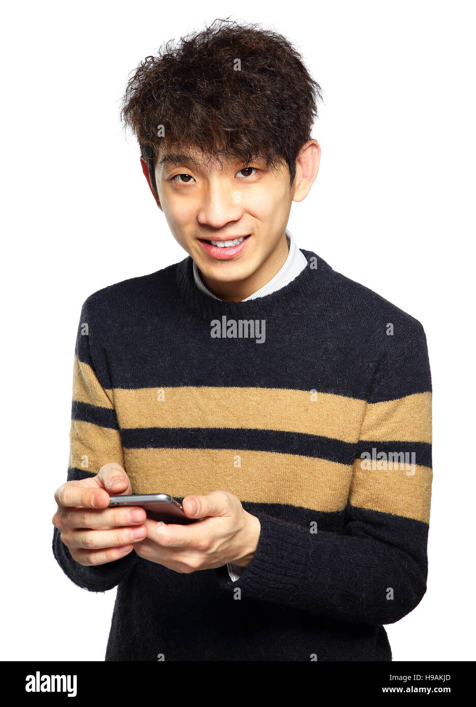 Young man using mobile phone SMS on white background Stock Photo - Alamy
