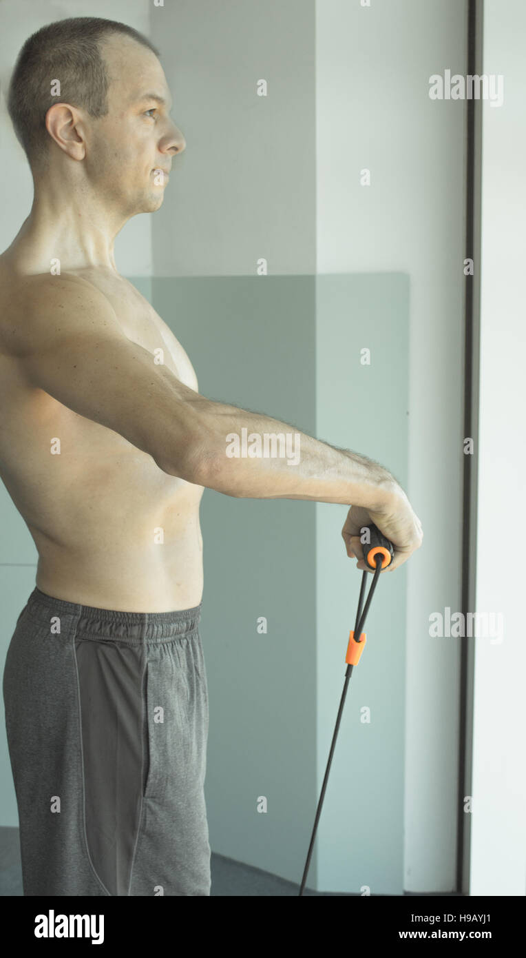 Performing exercises with resistance rope fitness Stock Photo - Alamy