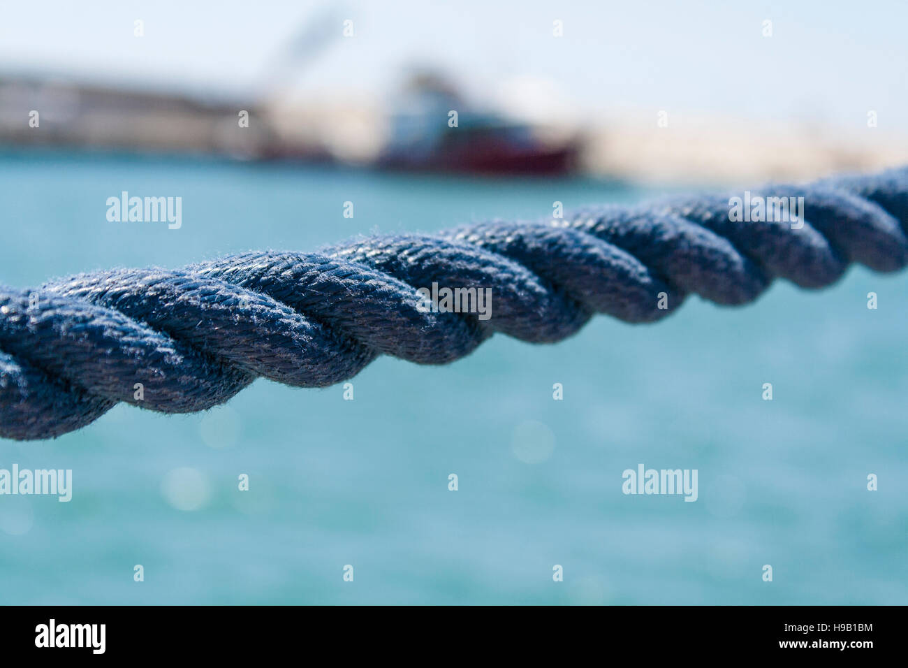 Nautical background. Closeup of an old blue boat rope Stock Photo - Alamy