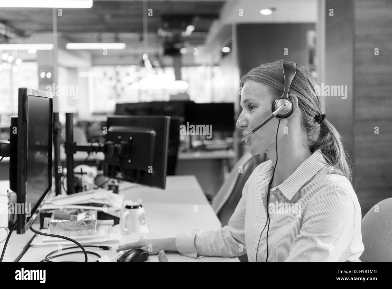 female customer support phone operator with headset at workplace Stock ...