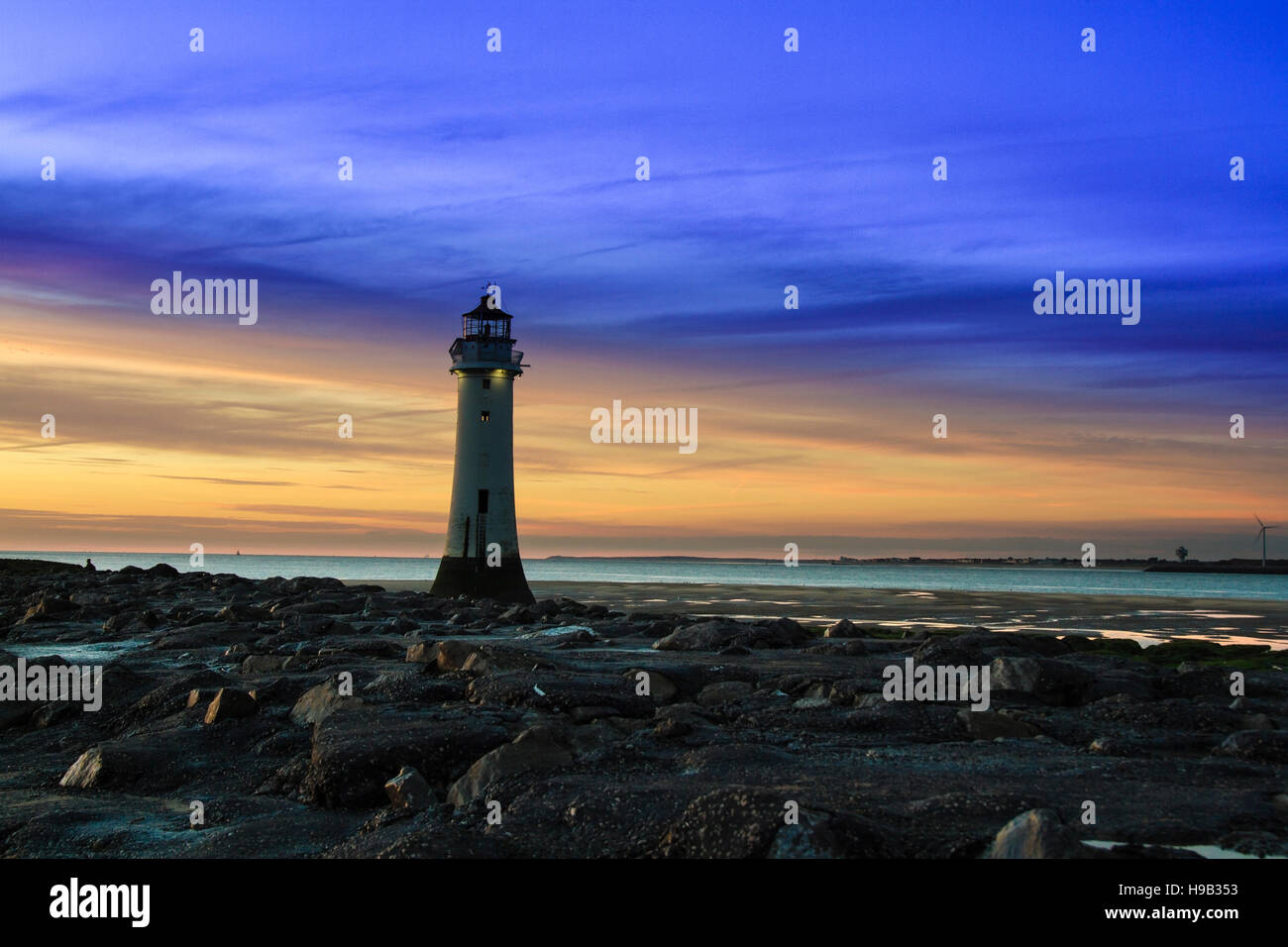 gorgeous sunset behind liverpool lighthouse Stock Photo - Alamy