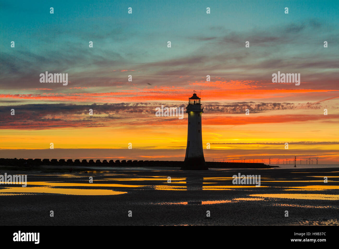 gorgeous sunset behind liverpool lighthouse Stock Photo - Alamy