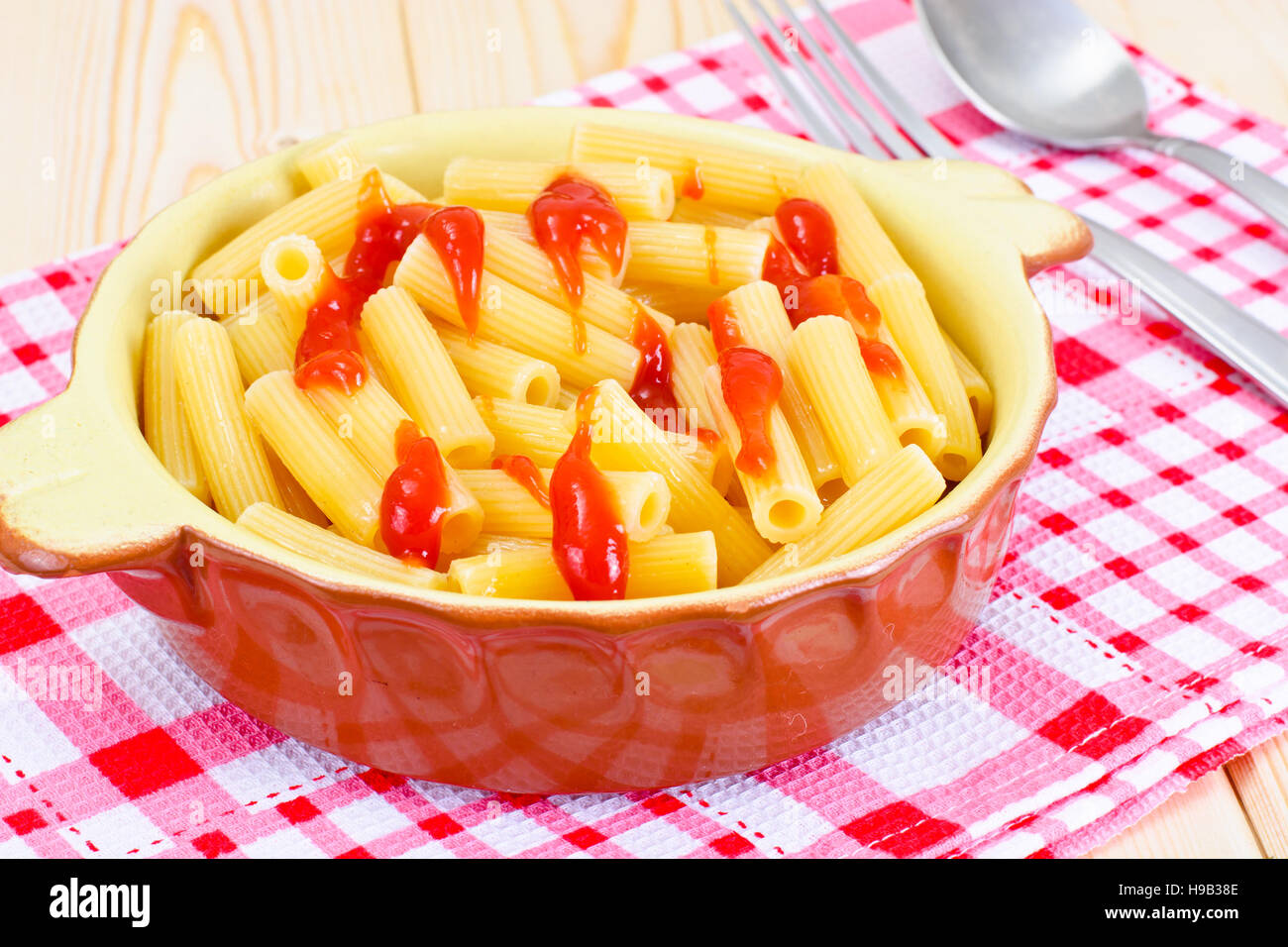 Pasta with Tomato Ketchup Sauce, Green Onions and Cheese Studio Photo ...