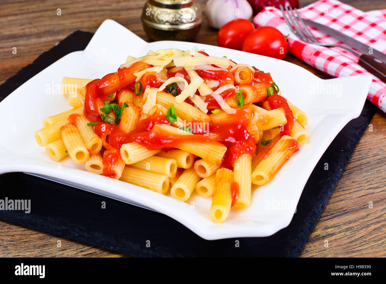 Pasta with Tomato Ketchup Sauce, Green Onions and Cheese Studio Photo ...