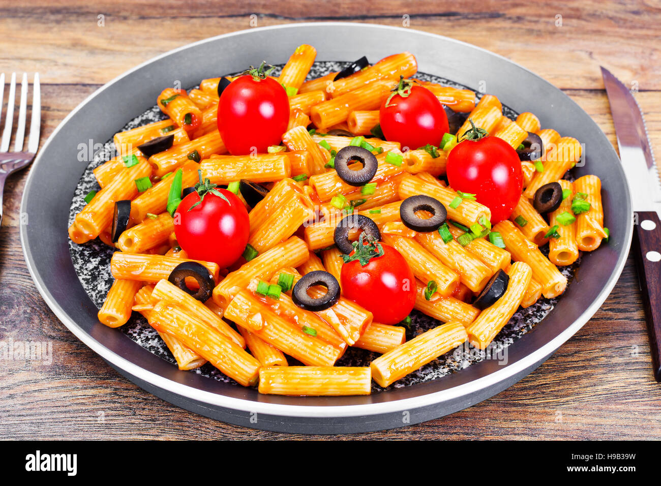 Pasta with Tomato Ketchup Sauce, Green Onions and Cheese Studio Photo ...