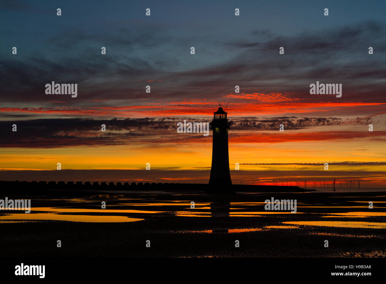 gorgeous sunset behind liverpool lighthouse Stock Photo - Alamy
