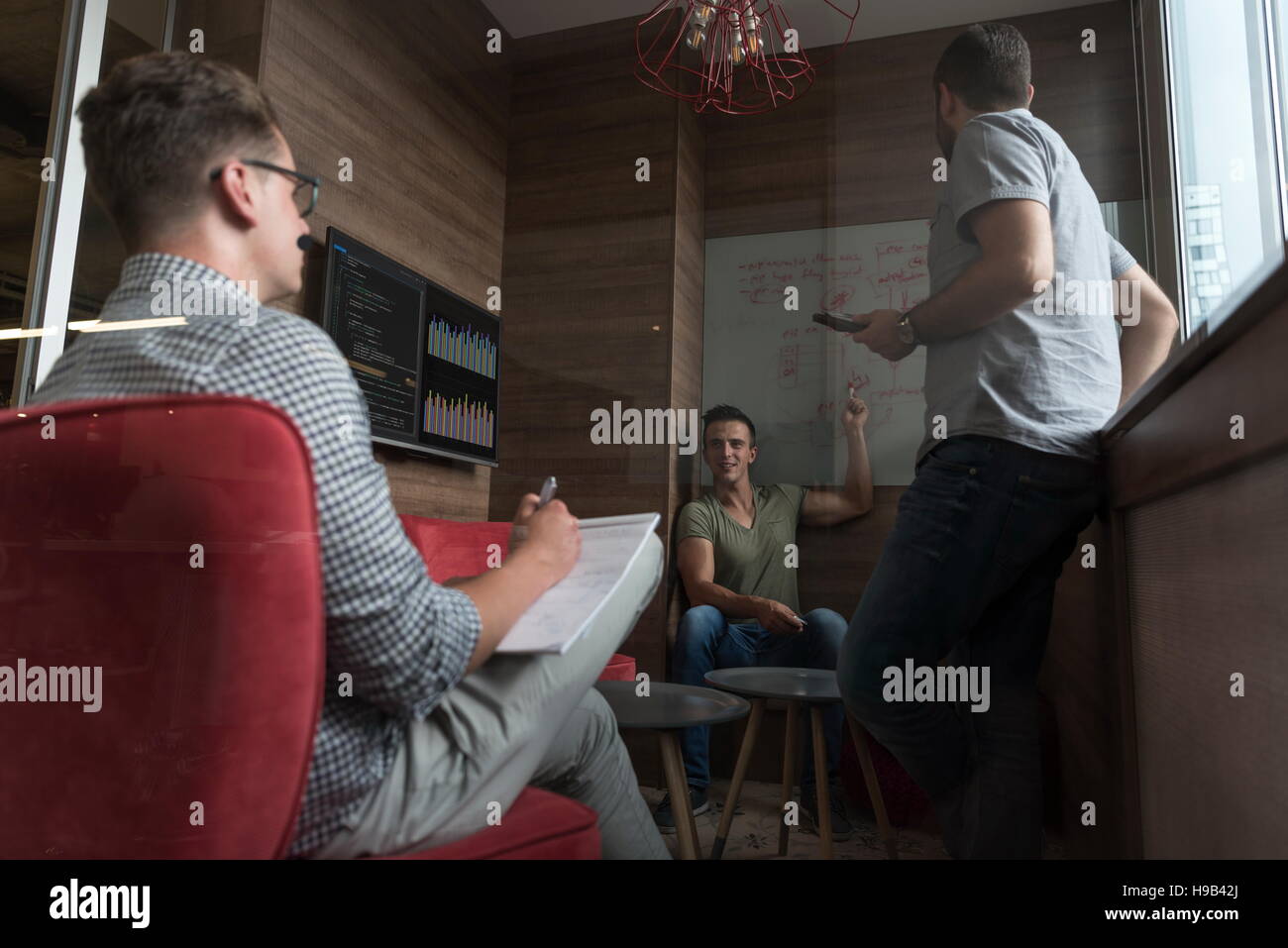 young people group in small private office have team meeting and ...